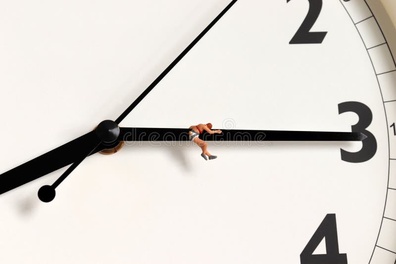 A Miniature Woman Hanging from a Clock Needle. Stock Image - Image of ...