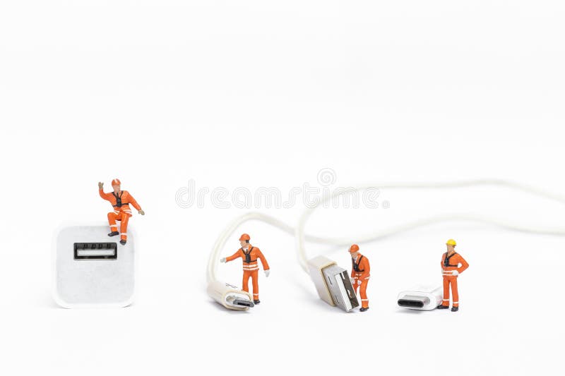 Miniature Worker with Different Kind of USB Charging Cable Stock Image ...