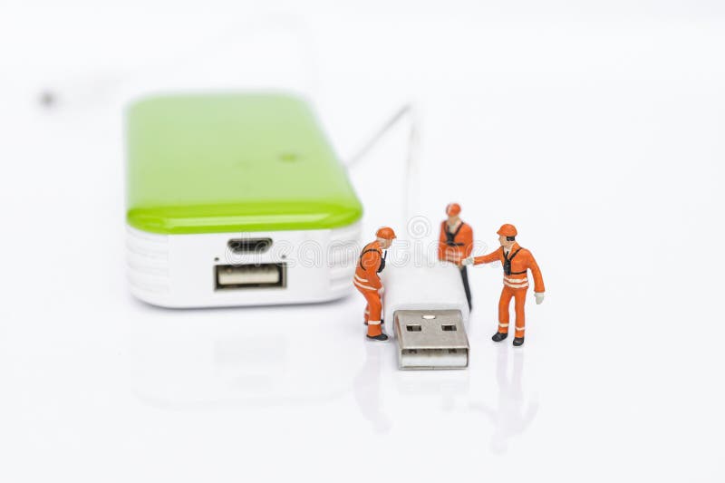 Miniature Worker Team with USB Cable and Power Bank Isolate on White ...