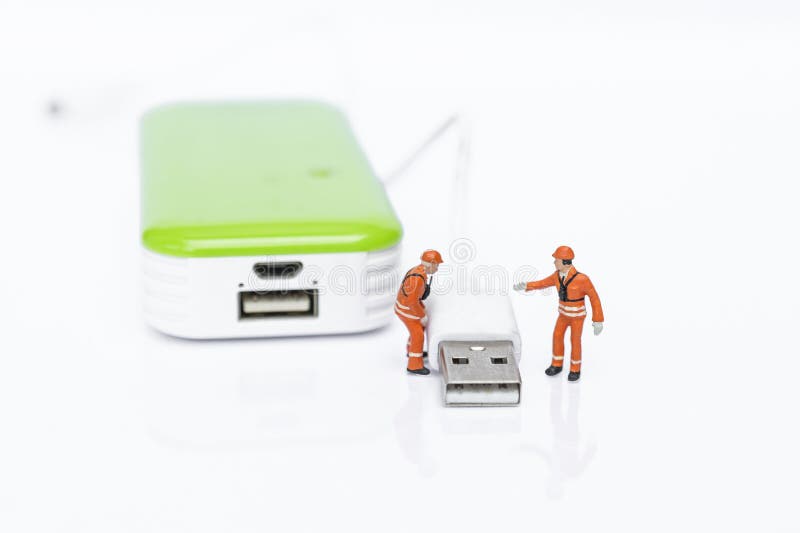 Miniature Worker with USB Cable and Power Bank Isolate on White ...