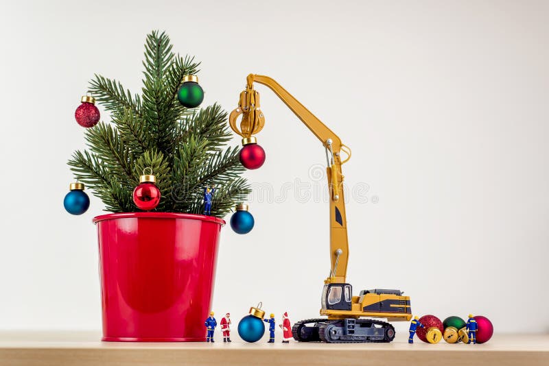 Miniature Workers Decorating Christmas Tree Stock Photo - Image of decor, concept: 131792176