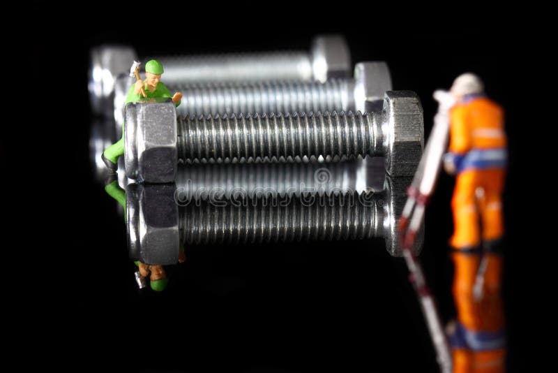 Miniature workers nut bolt stock photo. Image of hardware - 65861974