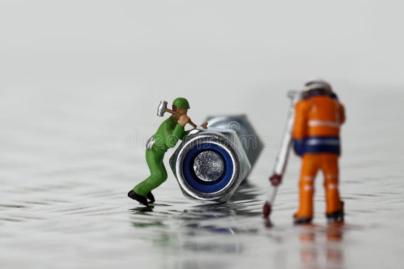 Miniature workers nut bolt stock photo. Image of hardware - 65861994