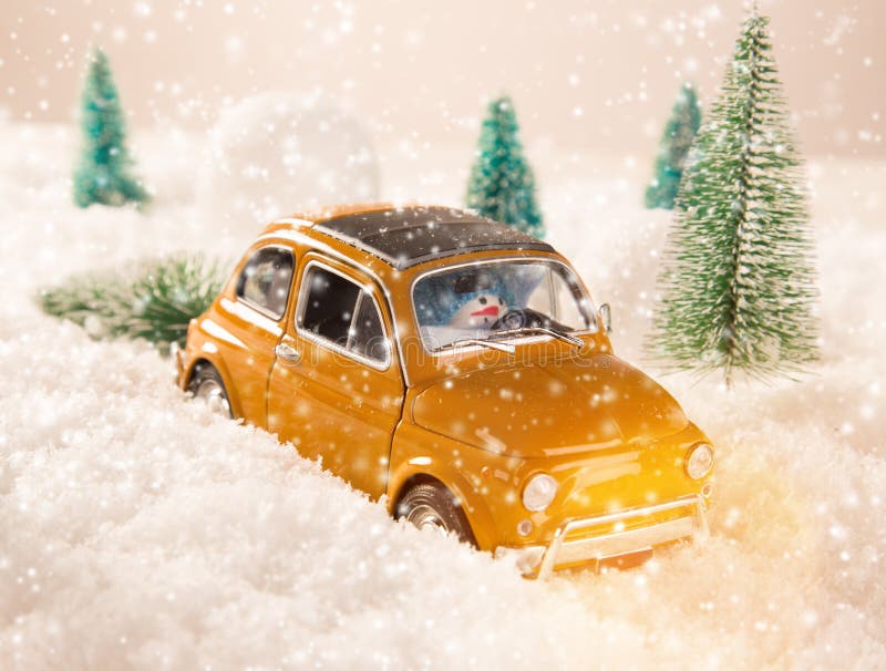 Miniature Yellow Car with Spruce Trees Stock Image - Image of holiday ...