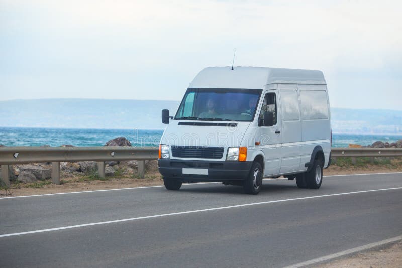 Minibus Moves Along the Road Along the Sea Stock Image - Image of ...