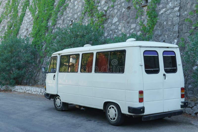 Minibus is Parked on the Edge of the Road. Back View Stock Image ...