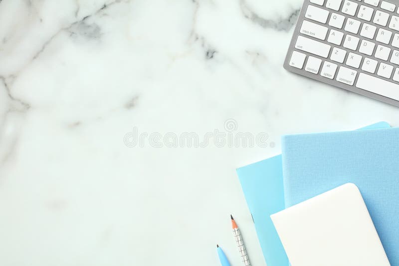 Minimal Elegant Workspace with Paper Notebooks and Keyboard on Marble ...