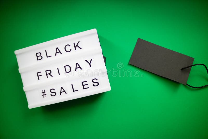 Minimal Flat Lay of Light Box and Black Label on Green Background Stock ...