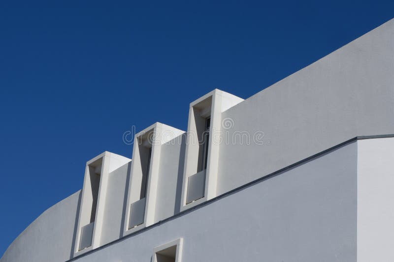 Minimal Lines of Modern White Building Against Saturated Blue Sky ...