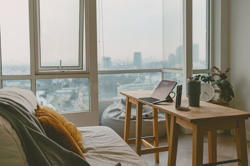 Minimal and Loft Living Room Design with Iced-coffee and Computer in ...
