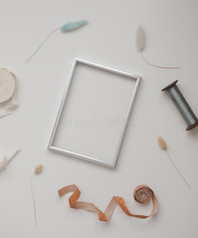 Minimal Mockup with Blank Frame with Sewing Thread and Sewing Items on ...