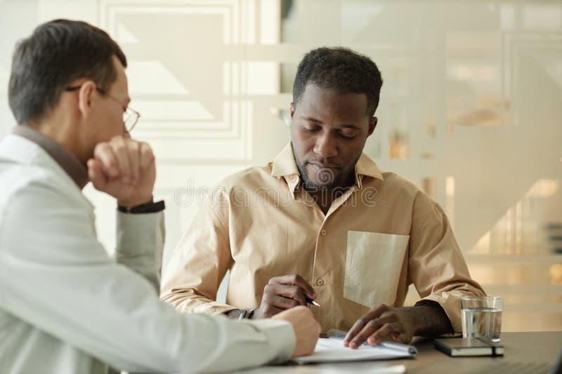 Black Man Working on Project with Colleague Stock Photo - Image of ...
