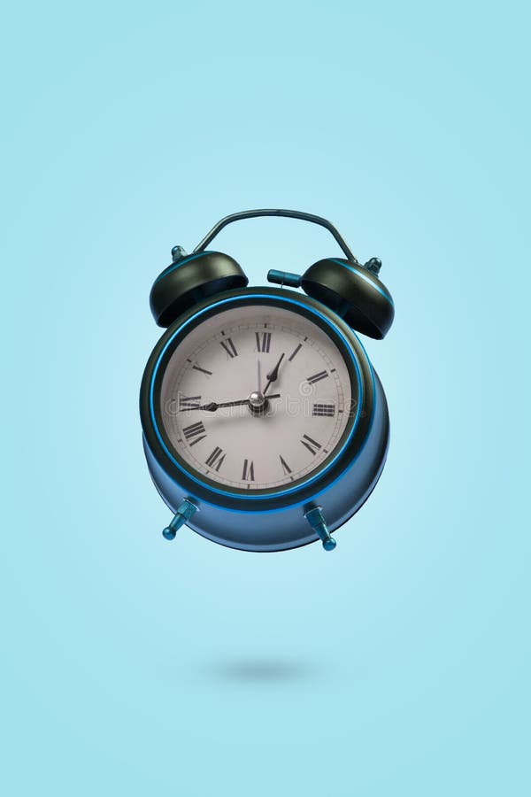 Minimal Scene with an Alarm Clock Floating in the Air on a Blue ...