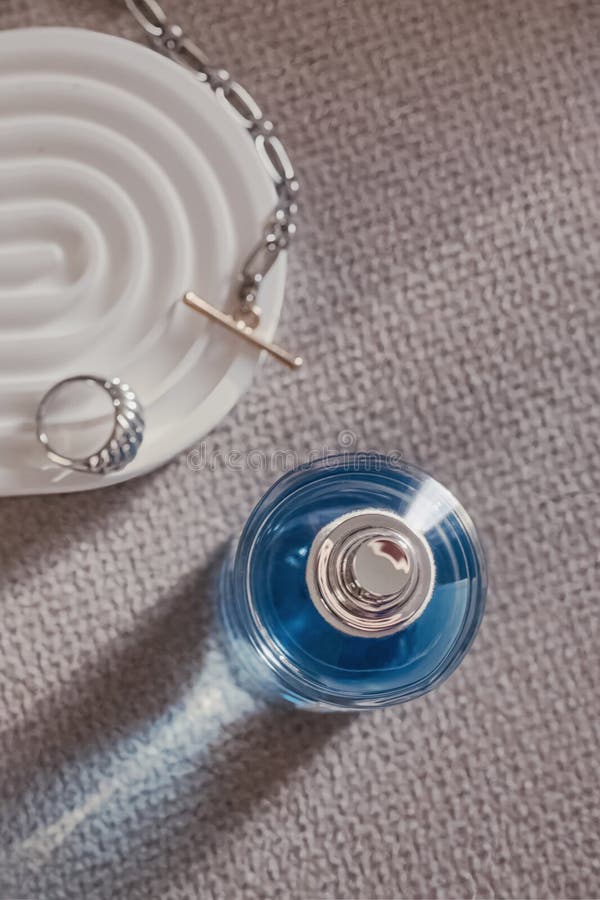 Minimal Still Life Composition with Perfume Bottle and Jewelry Stock ...