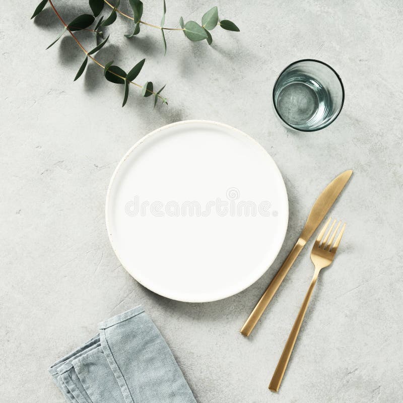 Minimal Styled Table Setting with Eucalyptus Branches. Top View with ...