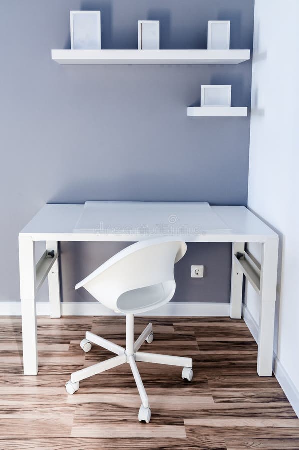 Empty Workplace with White Table and Shelves with Frames for Photos ...