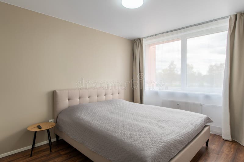 Minimalism Bedroom Interior. Wardrobe in Background. Coffee Table and ...