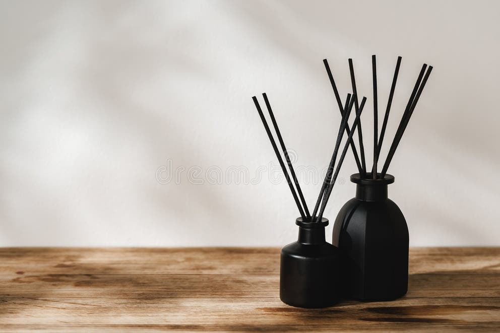 Minimalist Aromatic Reed Diffusers on a Wooden Surface Against a Soft ...