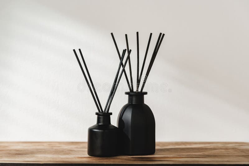 Minimalist Aromatic Reed Diffusers on a Wooden Surface Against a Soft ...