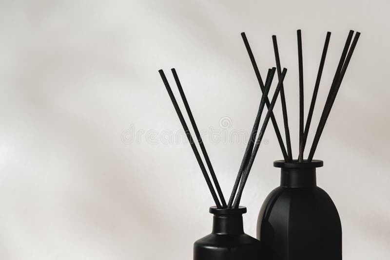 Minimalist Aromatic Reed Diffusers on a Wooden Surface Against a Soft ...
