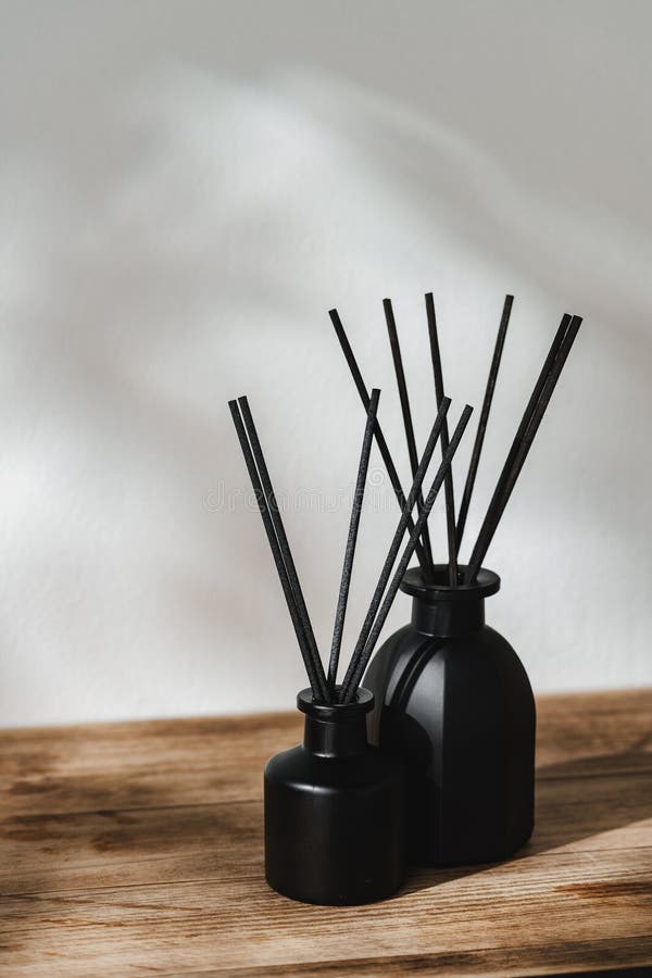 Minimalist Aromatic Reed Diffusers on a Wooden Surface Against a Soft ...