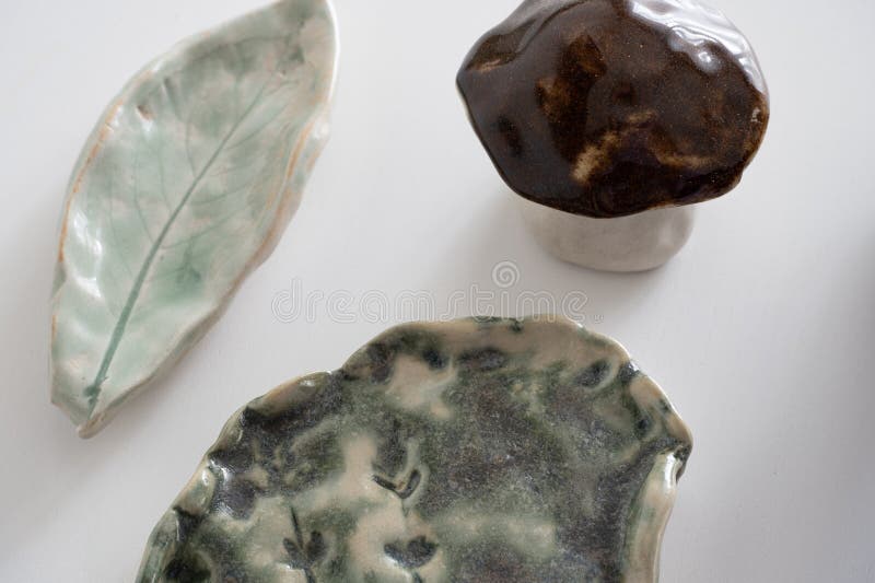 A Minimalist Arrangement of Handcrafted Ceramic Objects Displayed on a ...