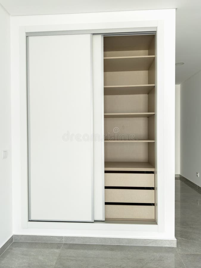 Minimalist Closet with an Organized Storage System Featuring Shelves ...