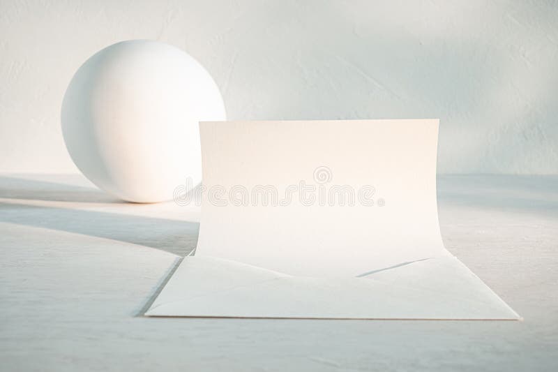 White Curved Paper Sheet and Sphere on a Pale Surface with Soft ...