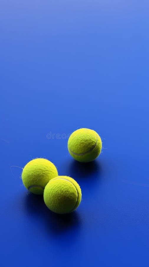 A Minimalist Composition Featuring Three Vibrant Tennis Balls Arranged ...