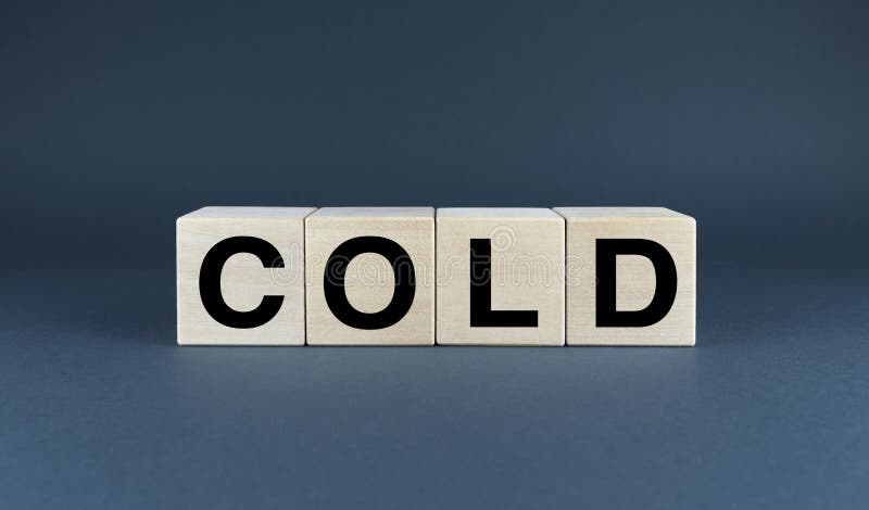 A Minimalist Composition Featuring Wooden Blocks Spelling the Word COLD ...
