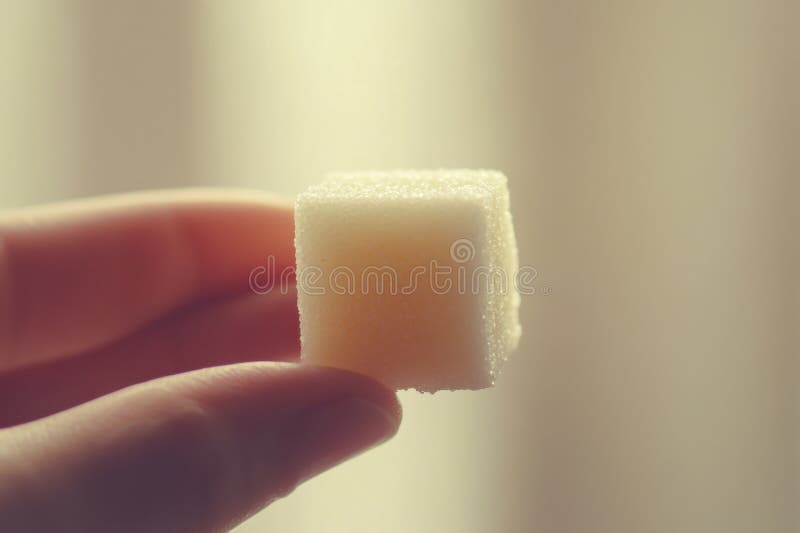 Minimalist Concept of Holding a Single Sugar Cube for Culinary and ...