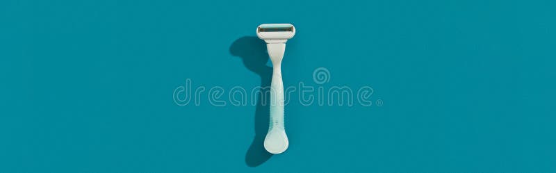 Minimalist Elegance: Razor in Sharp Relief Against a Bold Blue Backdrop ...