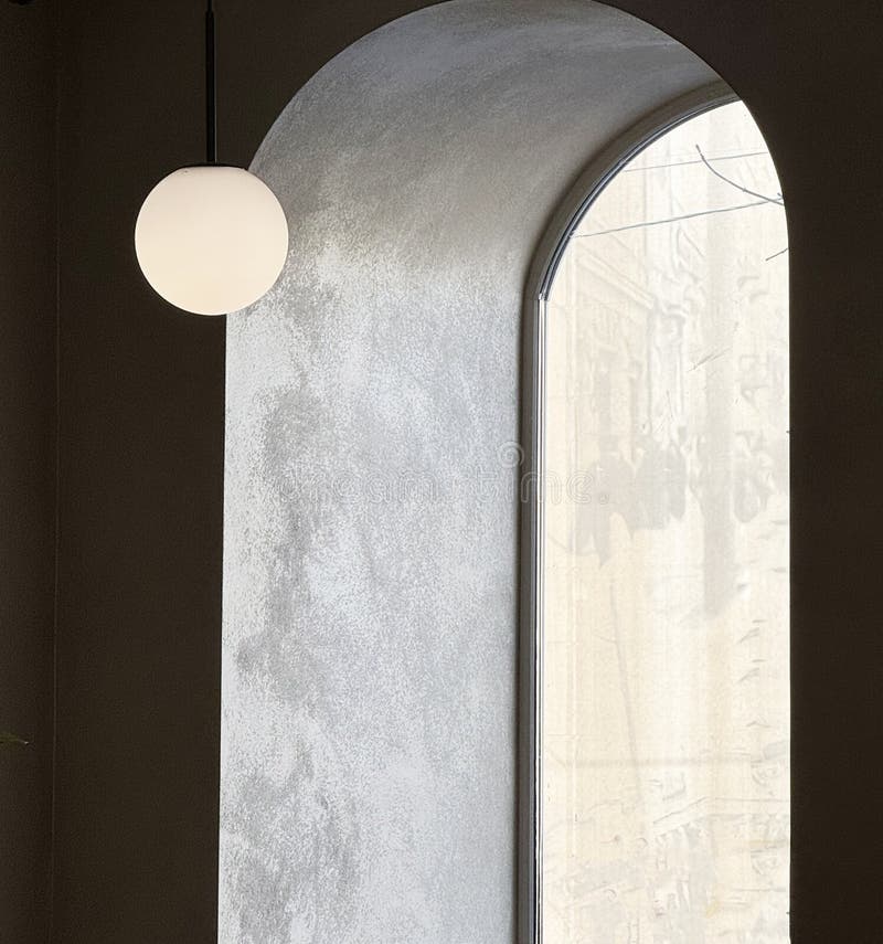 Minimalist Interior with Elegant Arch Window and Modern Pendant Light ...