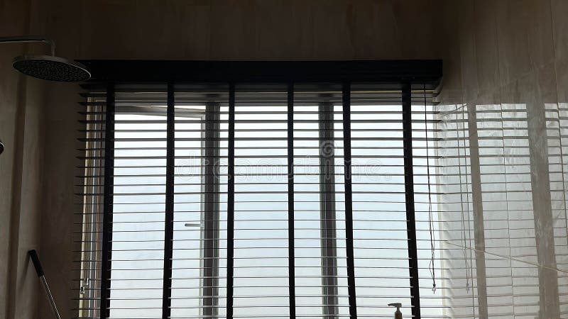 Minimalist Interior Window with Blinds Allowing Soft Natural Light and ...