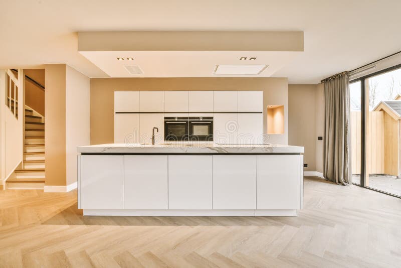 A Minimalist Kitchen with a Block System in White Design Stock Image ...