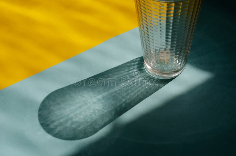 Minimalist Light and Shadow Composition with an Empty Glass on a Stock ...
