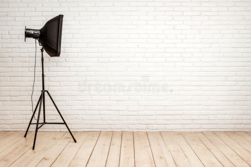 Minimalist Photography Studio with a Single Light Setup on Wooden Floor ...