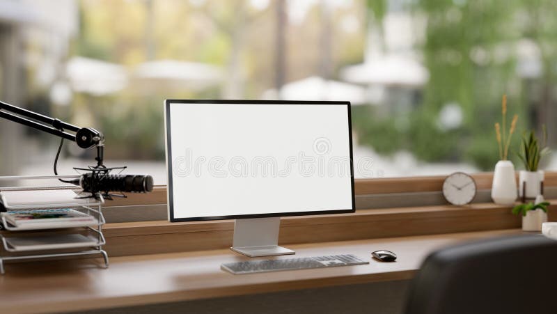 A Minimalist Podcast Studio Featuring a Microphone, a Computer with a ...