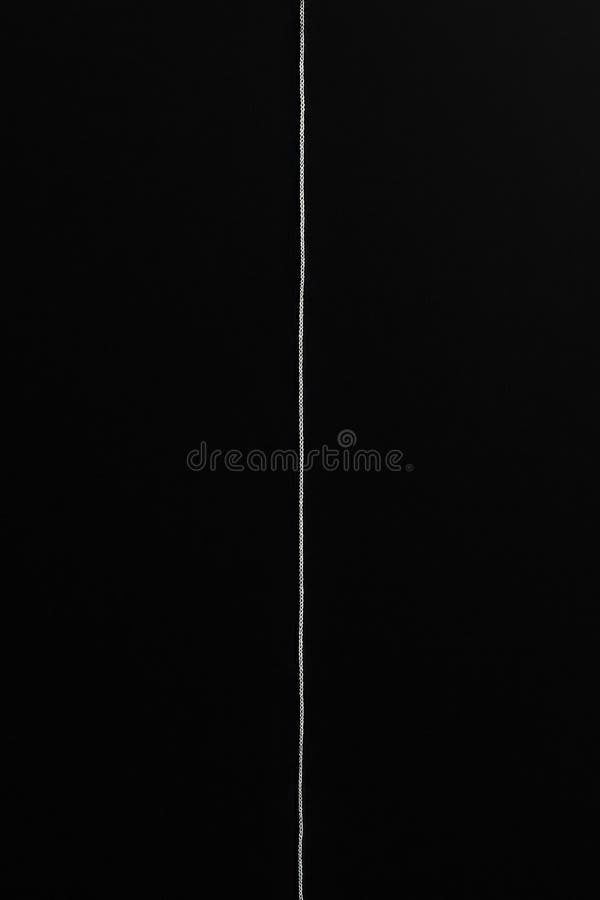 Minimalist Silver Rope Hanging Isolated on Dark Backdrop Stock Image ...