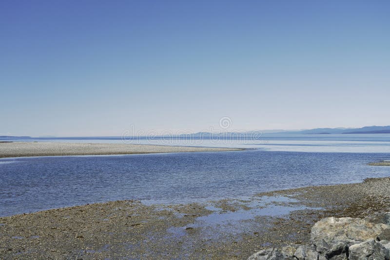 Minimalist View, the Distant Sky and Islands, the Ocean with a Sandbar ...
