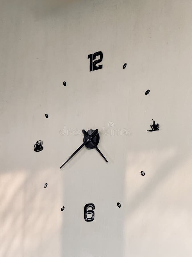 Minimalist Wall Clock with Black Numbers on White Wall Stock Photo ...
