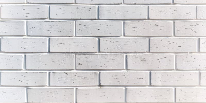 A Minimalist, White Brick Wall with Evenly Spaced Bricks and a Smooth ...