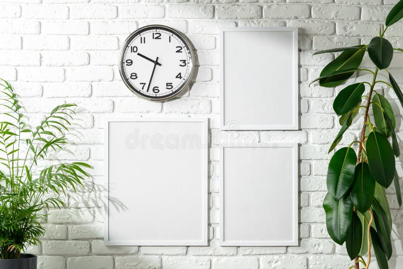 Minimalist White Wall Display with Clock and Empty Frames in a Modern ...