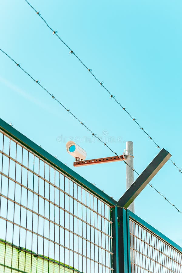 Minimalistic and Colorful Shot of a Surveillance Camera with a Wall and ...