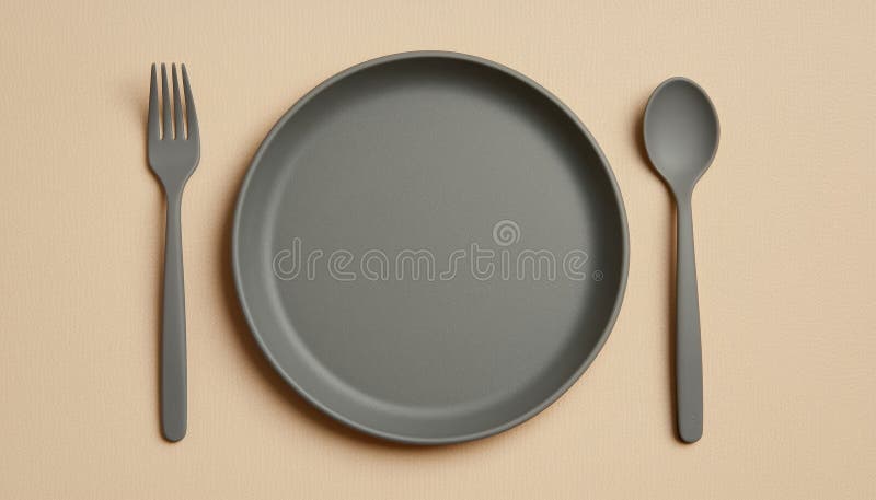 A Minimalistic Display of an Empty Gray Plate with Fork and Spoon on a ...