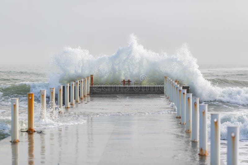 Minimalistic Seascape with Big Wave Hitting the Pier Stock Photo ...