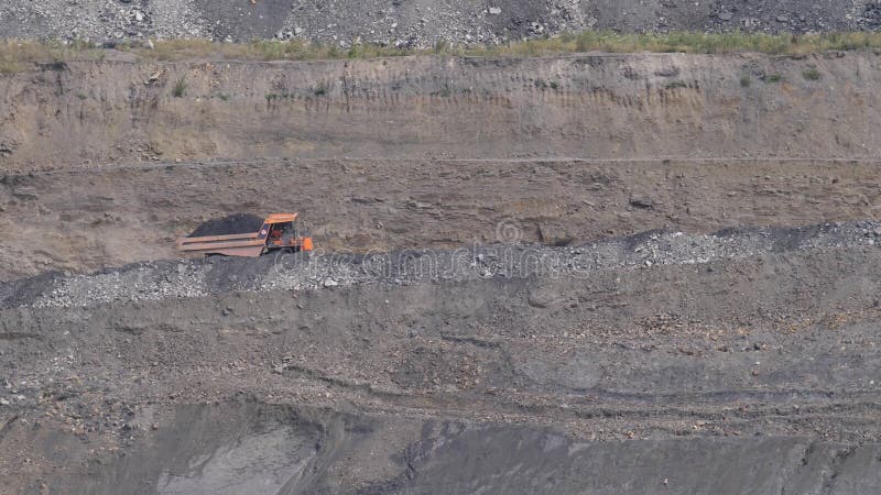 Mining Dump Trucks in the Open Pit Mine. the Dump Truck Goes on the ...