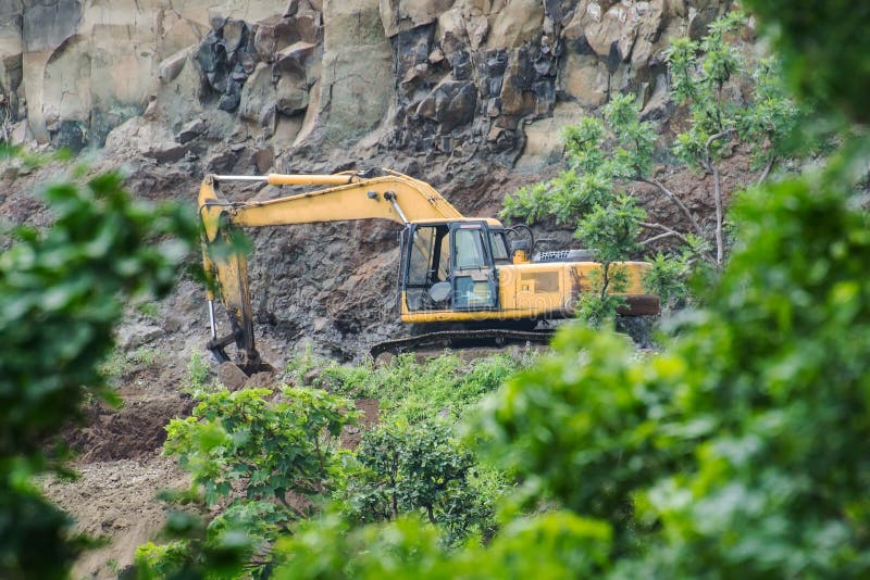 Mining by Excavator Backhoe Digger in Forest Stock Image - Image of ...