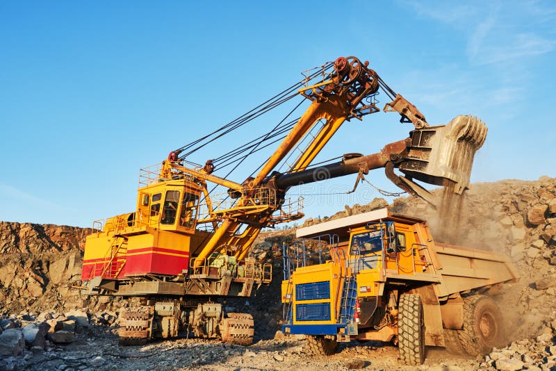 Mining. Excavator Loading Granite or Ore into Dump Truck Stock Photo ...
