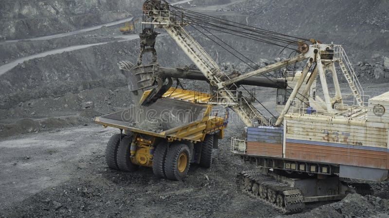 Mining Excavator Scooping Up Ore in a Quarry. Close Up of Limestone ...